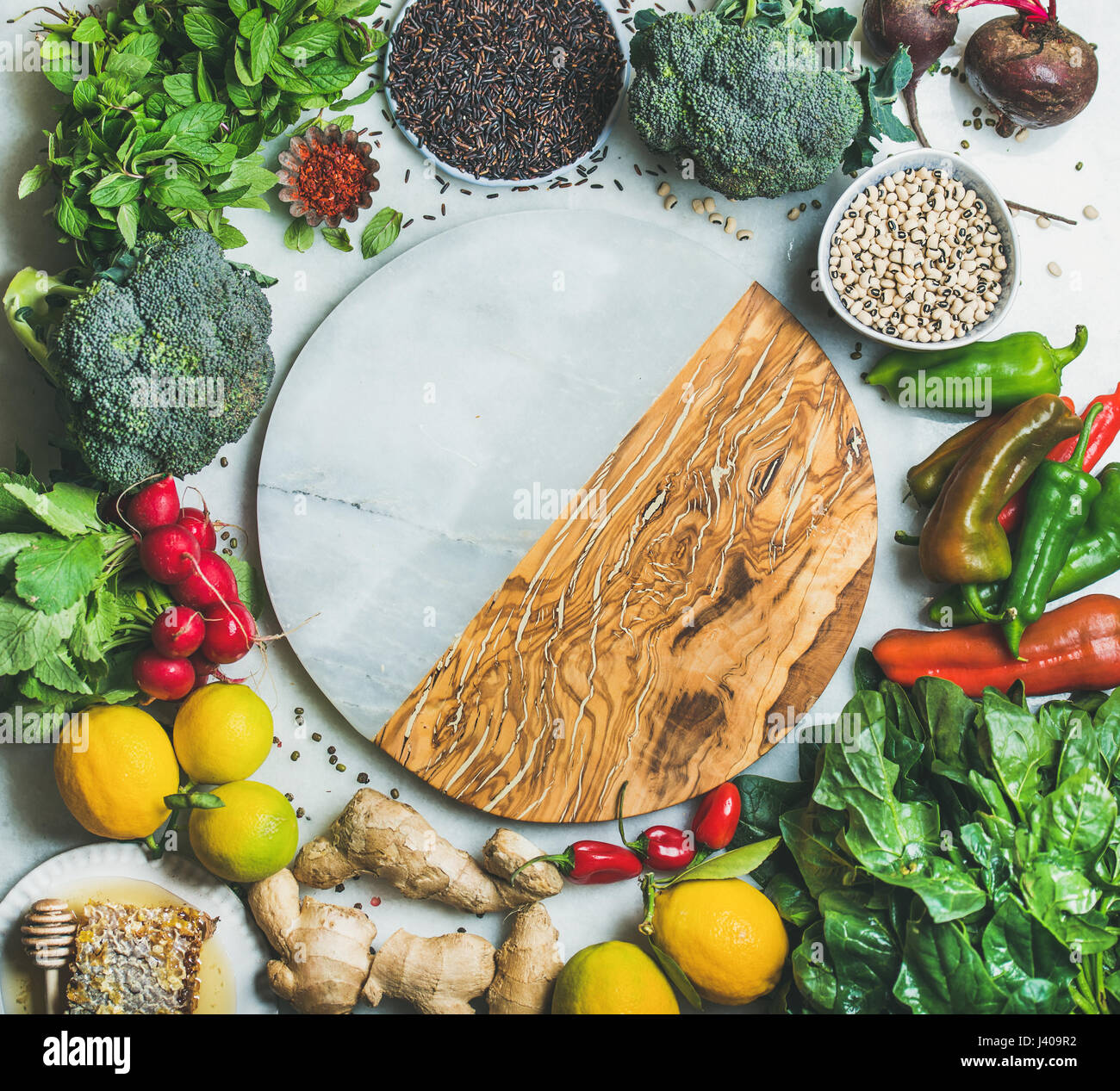 Clean eating healthy cooking ingredients with copy space in center ...