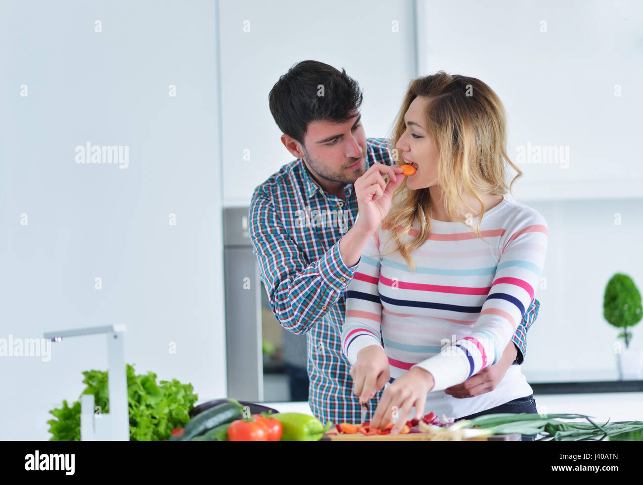 couple cooking healthy food in kitchen lifestyle meal preparation Stock ...