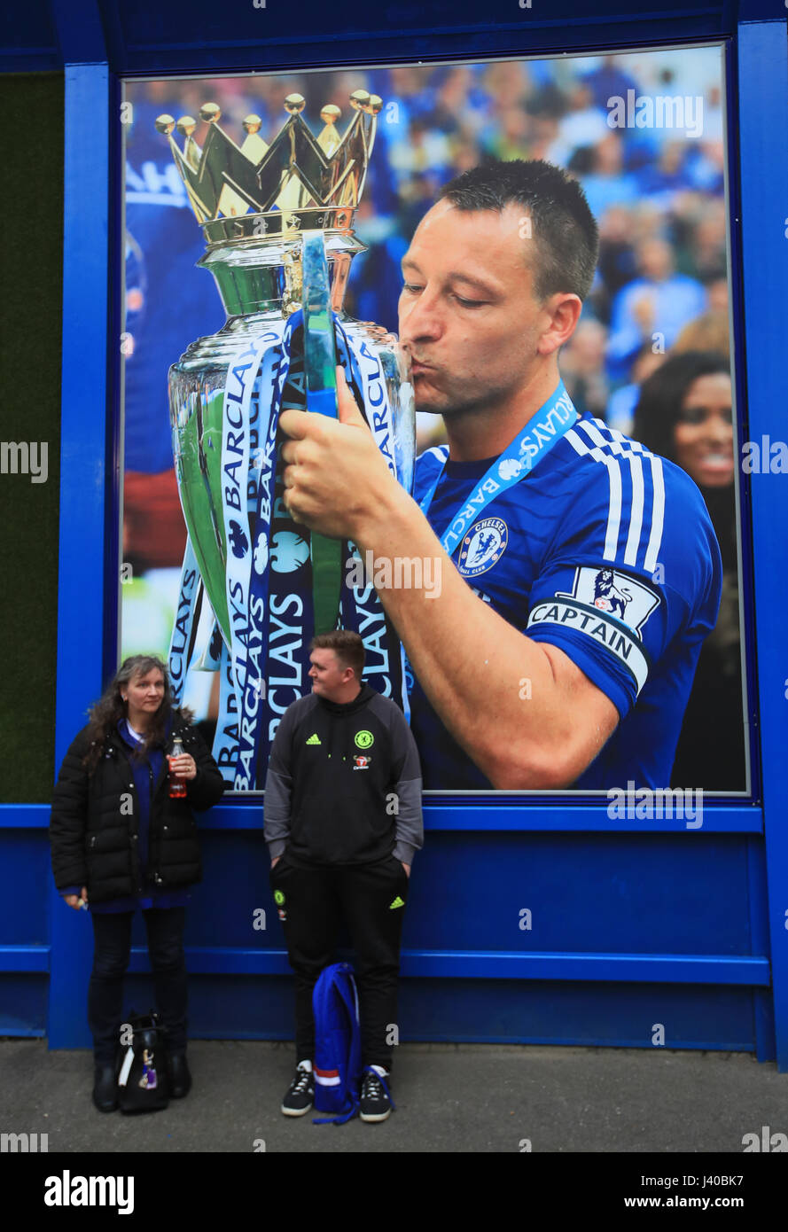 Fans stand next to an image of Chelsea's John Terry before the Premier ...