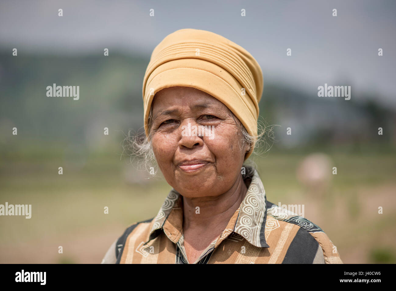 Portrait of a female rice field worker at the Harau Valley, Sumatra ...
