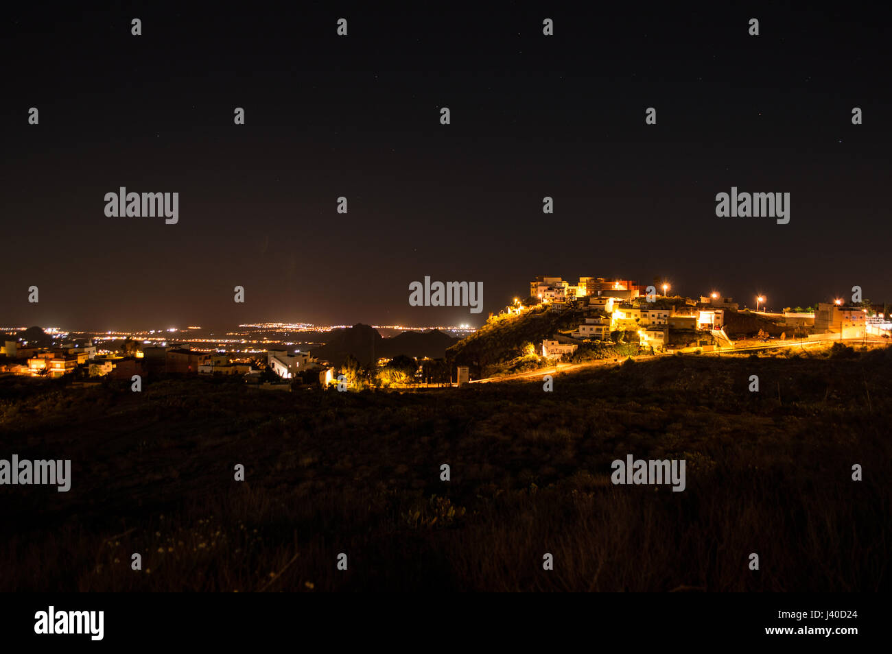 Beautiful Night Shot of Illuminated Spanish Village on a Hill with ...