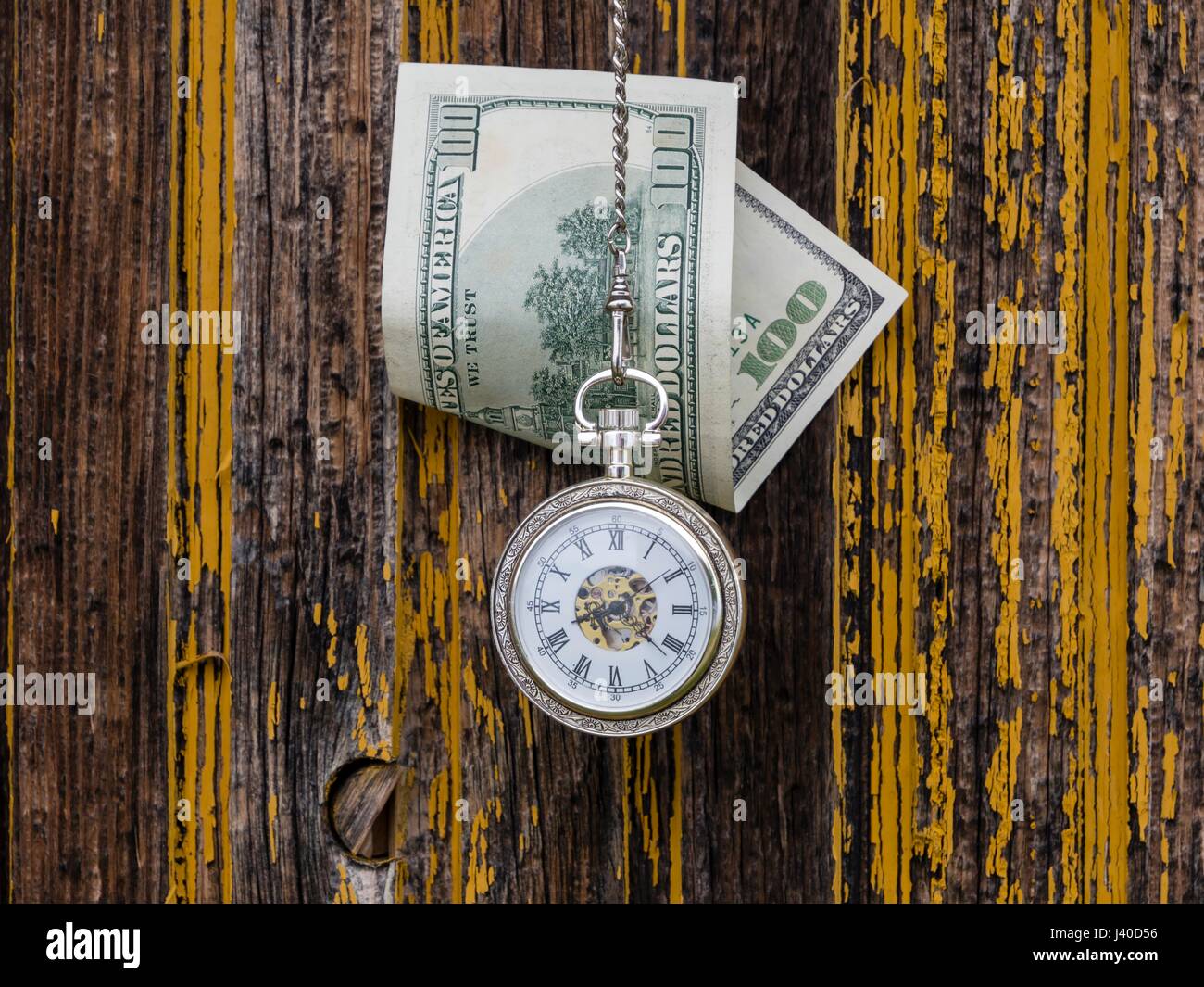 Time is money dollars and vintage pocket watch clock before derelict ...