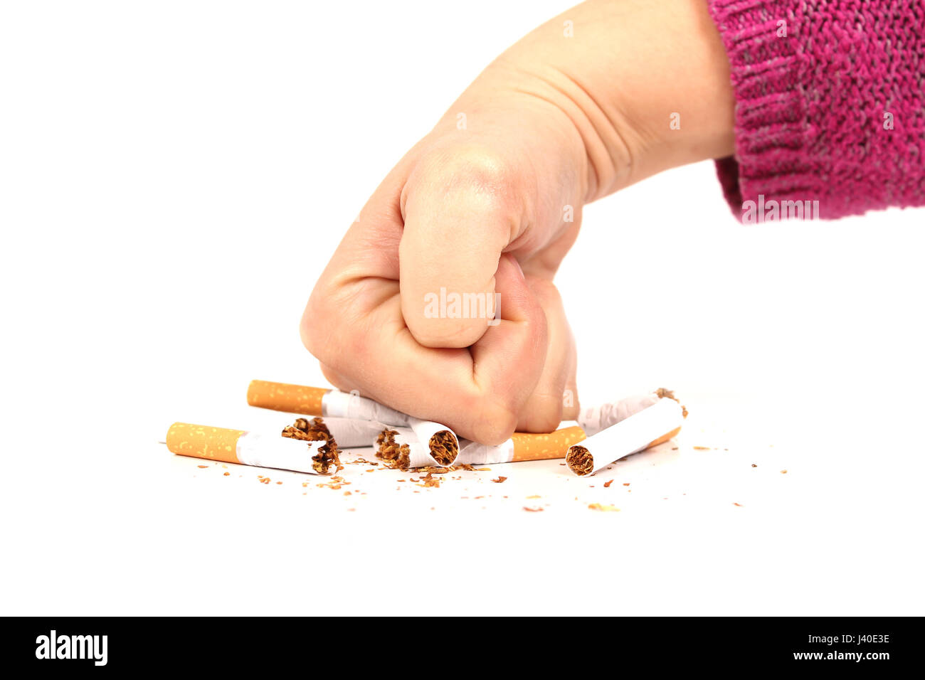 Woman's fist crushing cigarettes Stock Photo - Alamy