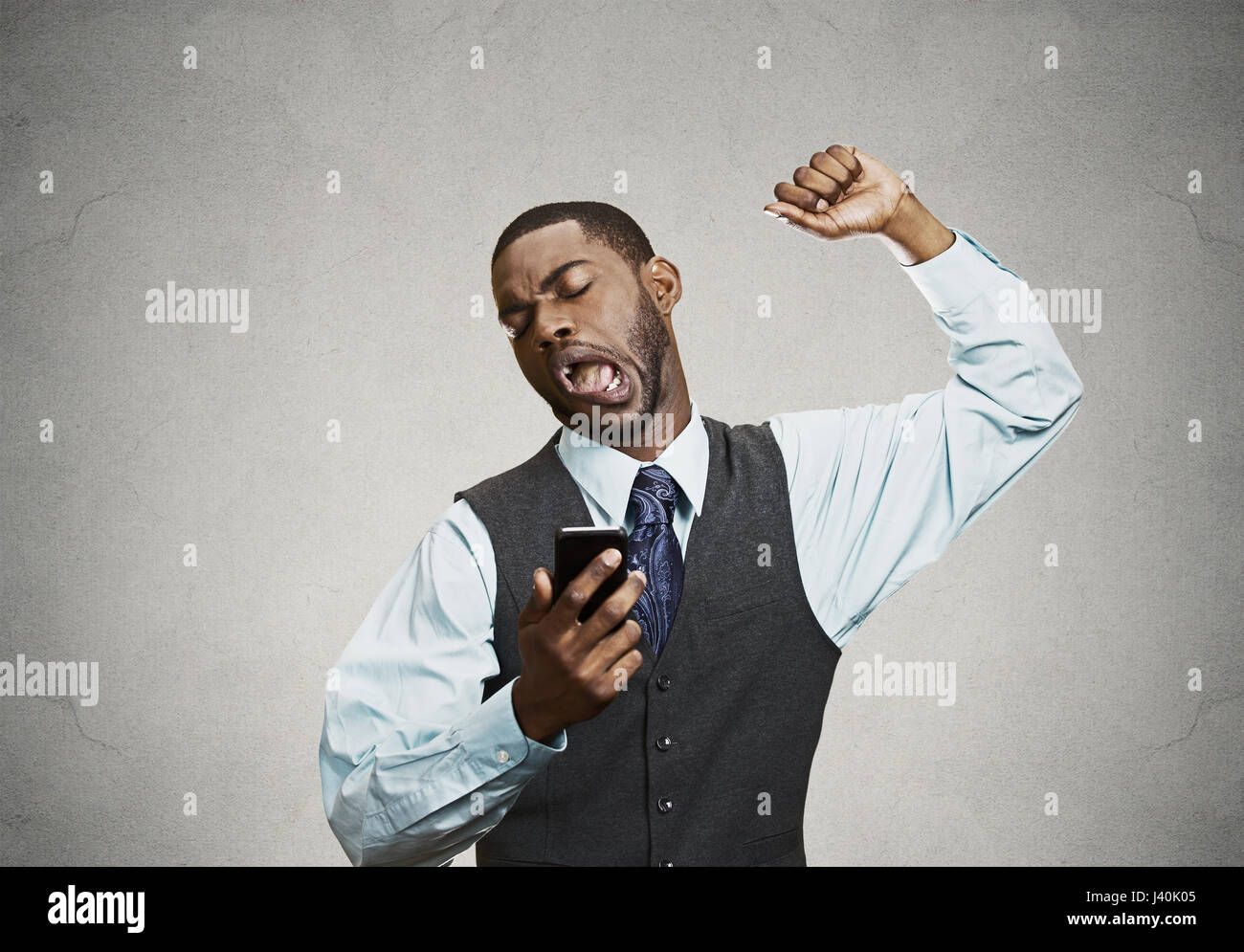 Closeup portrait sleepy young business man, funny guy stretching ...