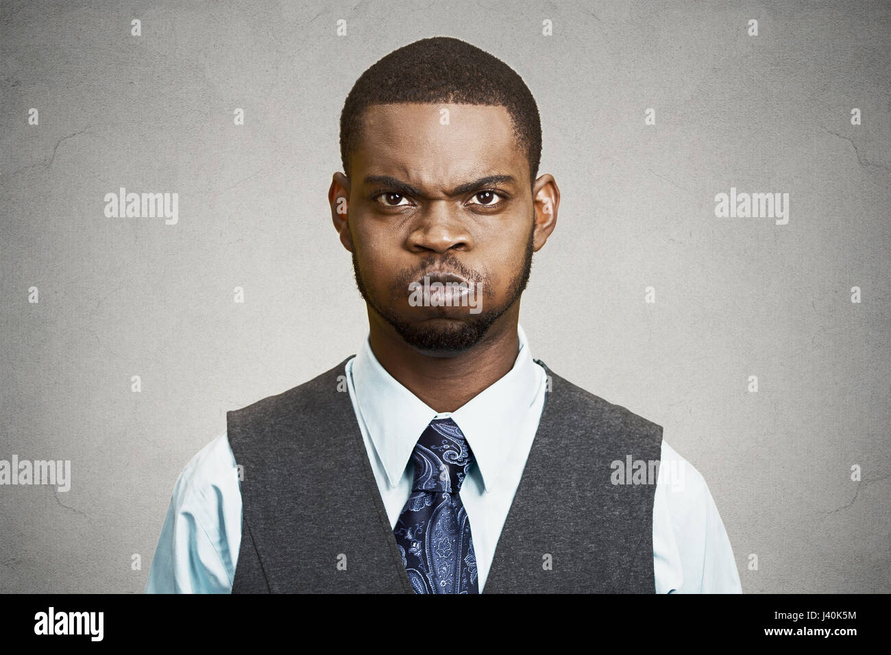 Closeup portrait angry young business man, blowing steam, about to have ...