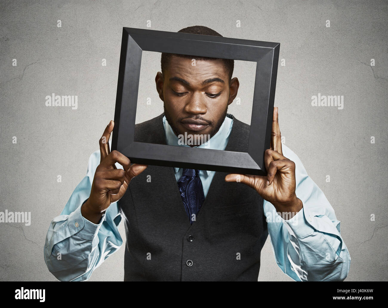 Closeup portrait businessman, executive looking down curious, surprised ...