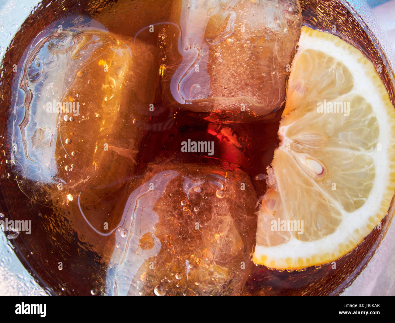 Soft drink with cola and a slice of lemon (top view Stock Photo - Alamy