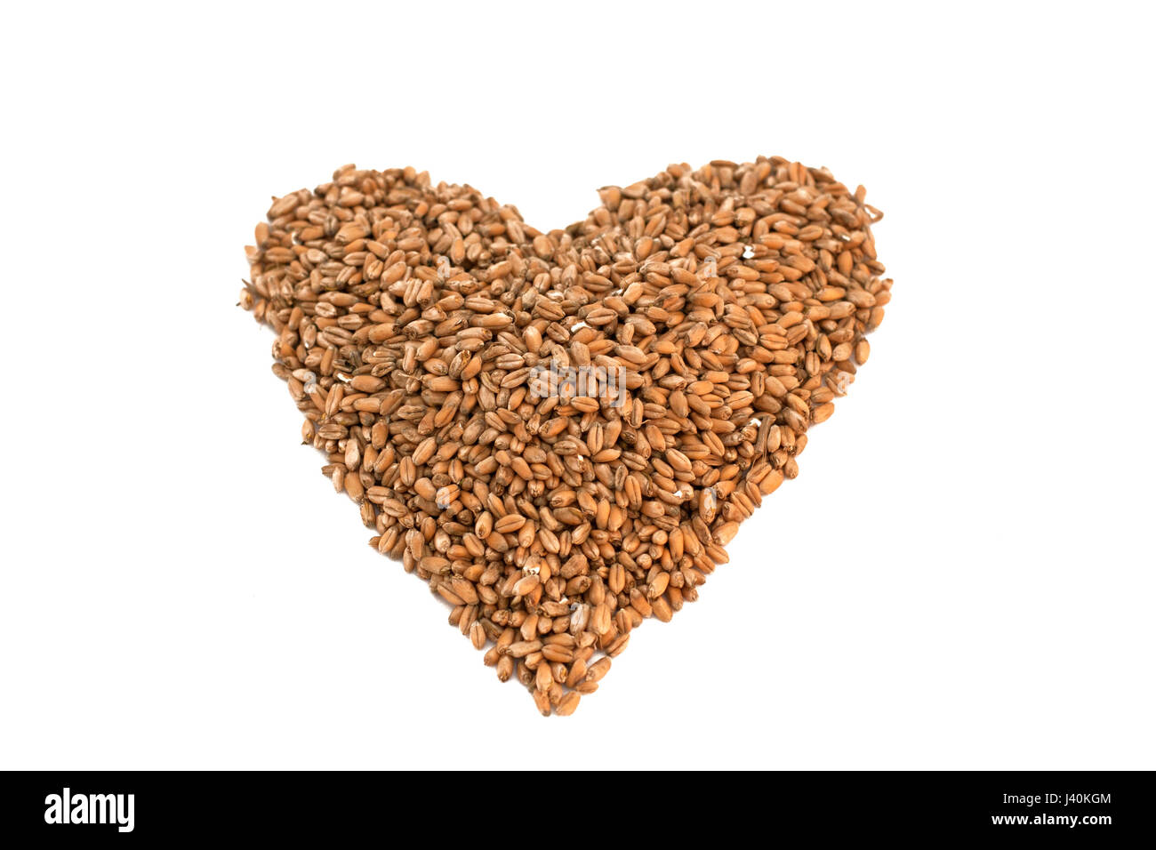 heart shaped wheat grain isolated on white background Stock Photo - Alamy