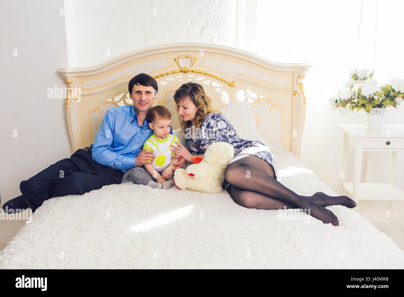 Family, parenthood and children concept - Happy mother, father and son ...