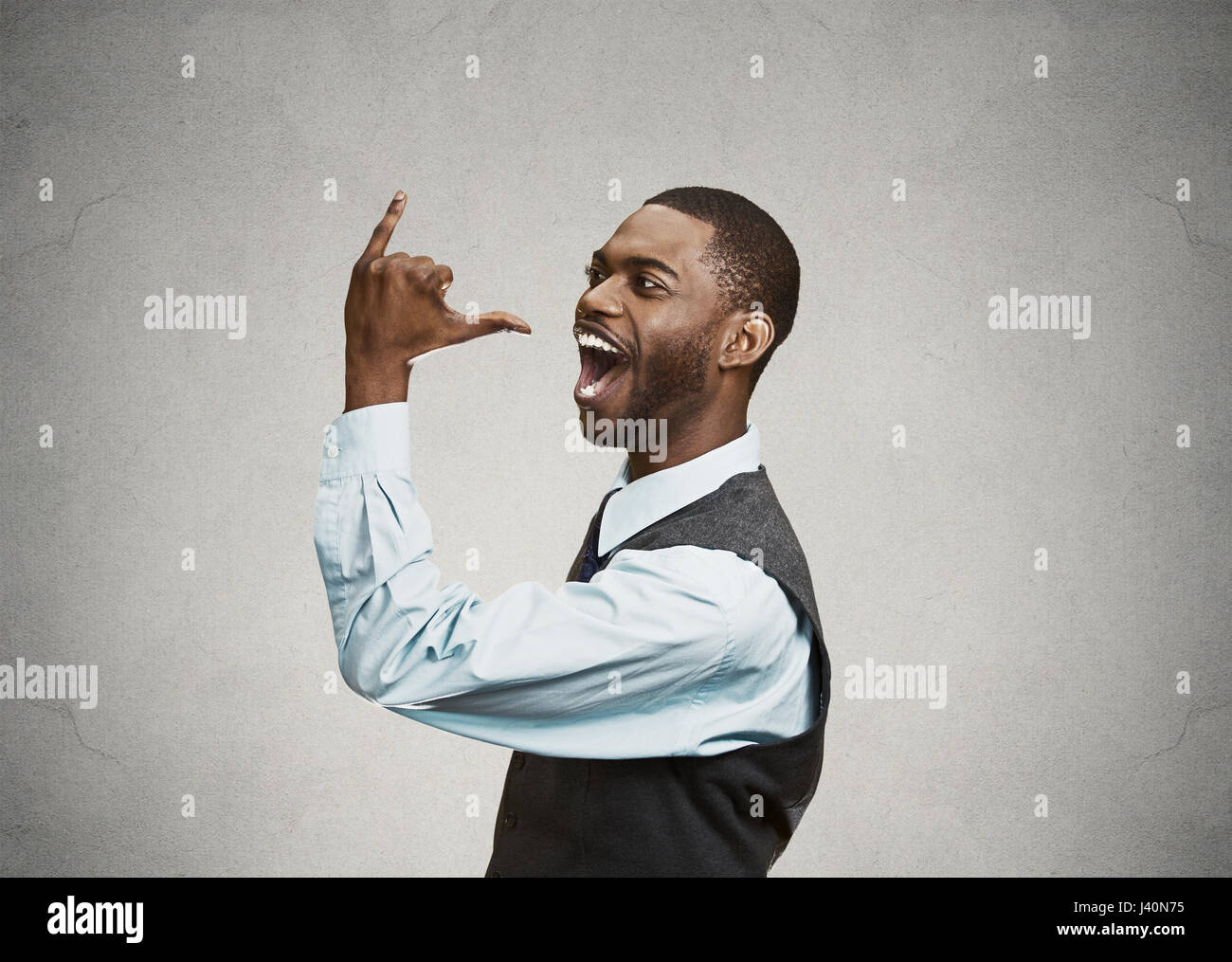 Closeup portrait happy silly goofy Man Gesturing with Hand thumb to go ...