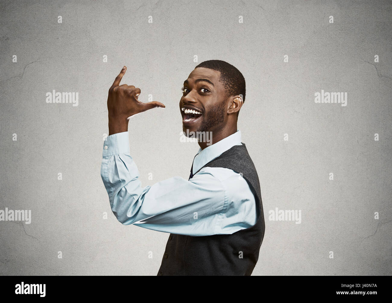 Closeup portrait happy silly goofy Man Gesturing with Hand thumb to go ...