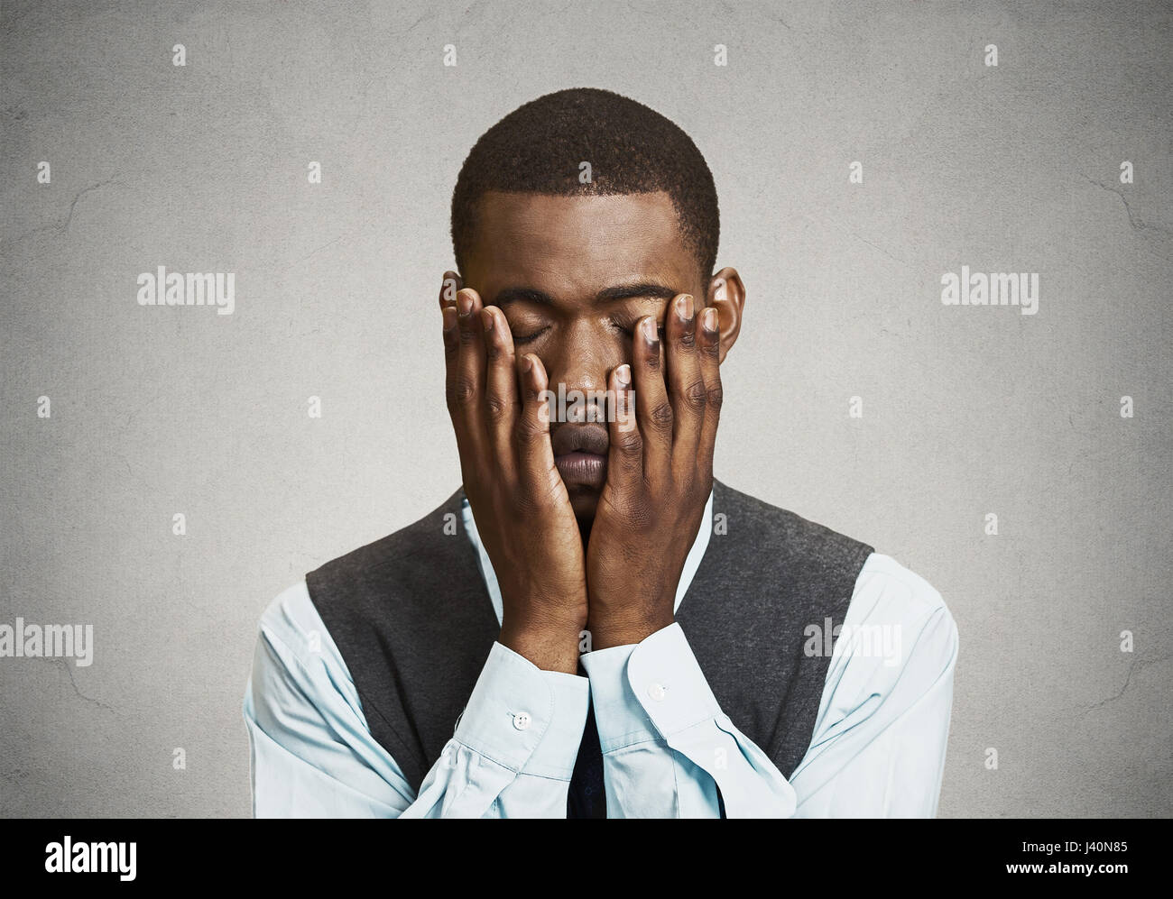 Closeup portrait, headshot Depressed young Man, isolated grey wall ...