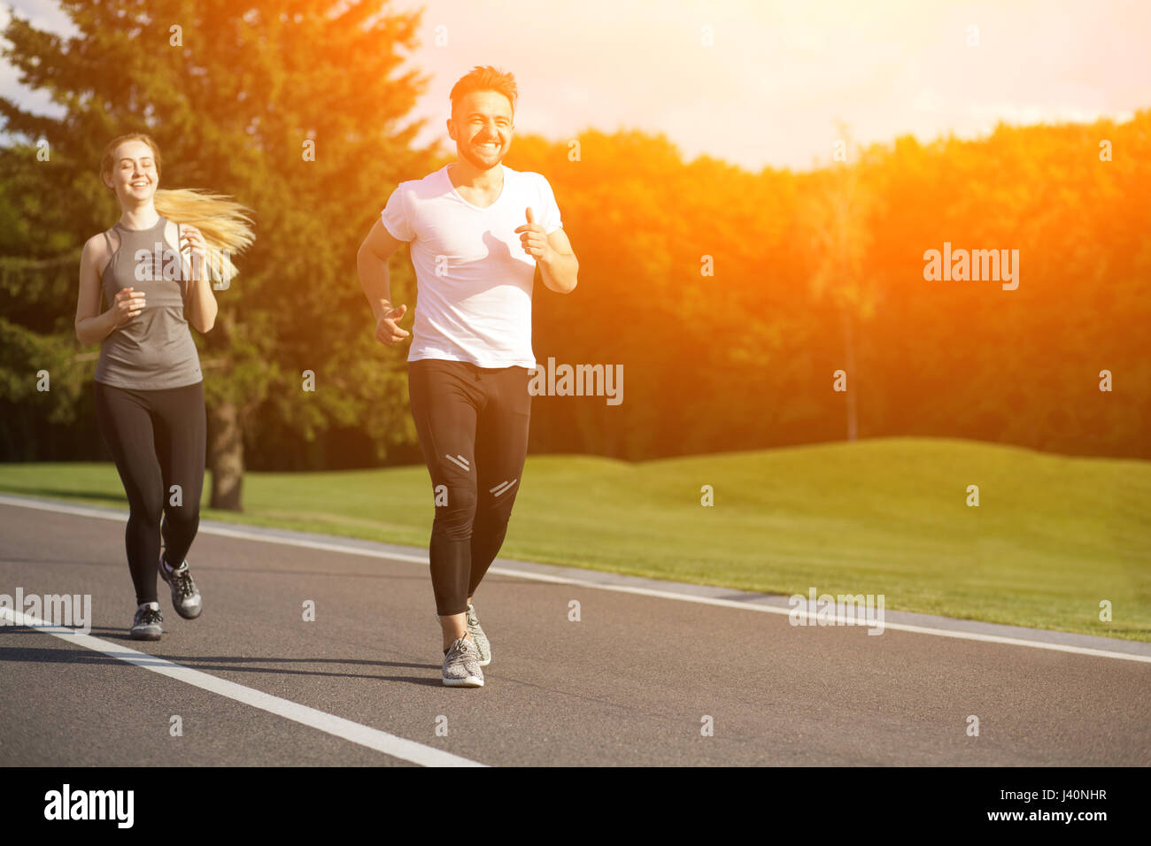 Man woman running exercise park hi-res stock photography and images - Alamy