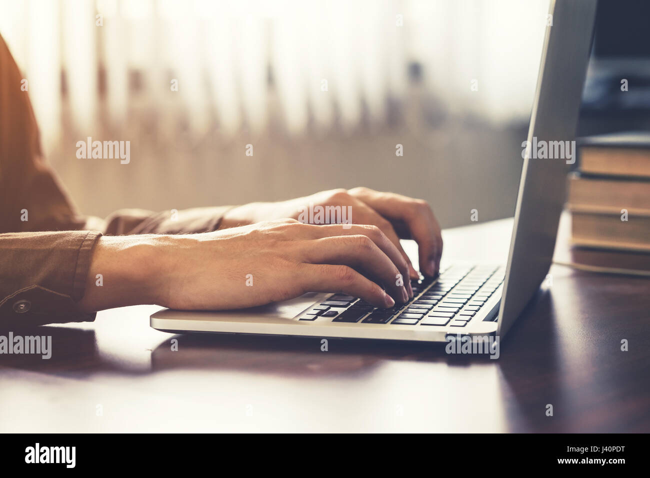Young business man hand using computer laptop in the office with ...