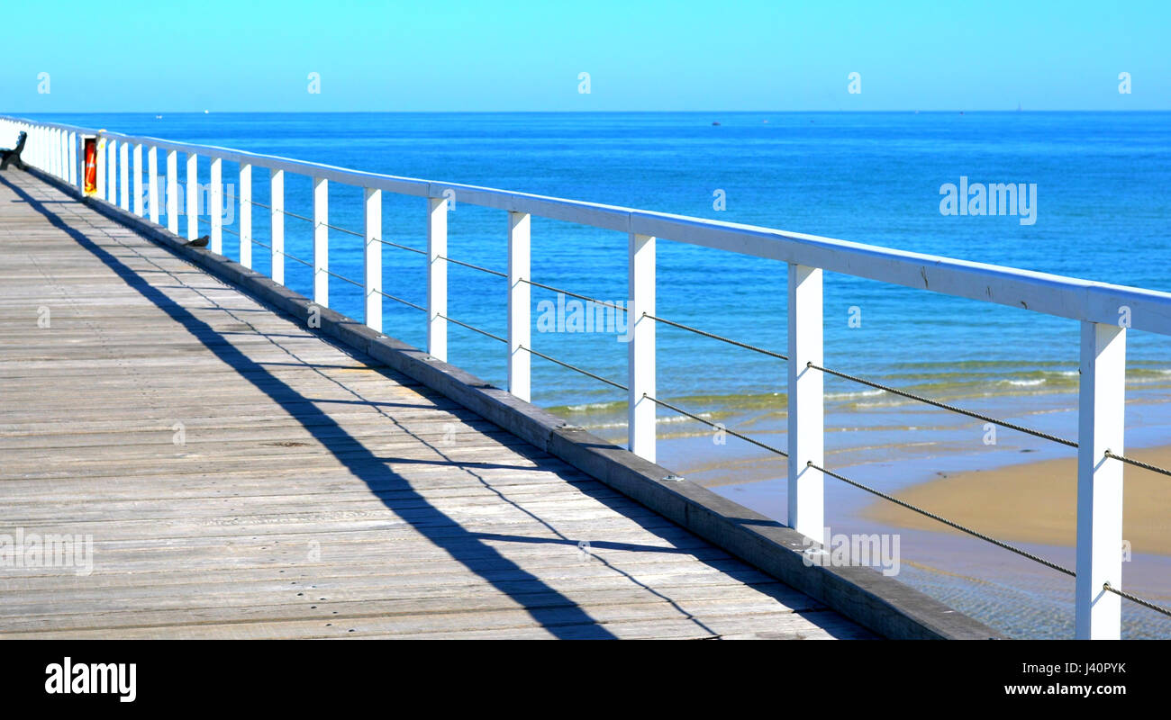 Overlooking sunny beach at low tide from jetty point of view Stock ...