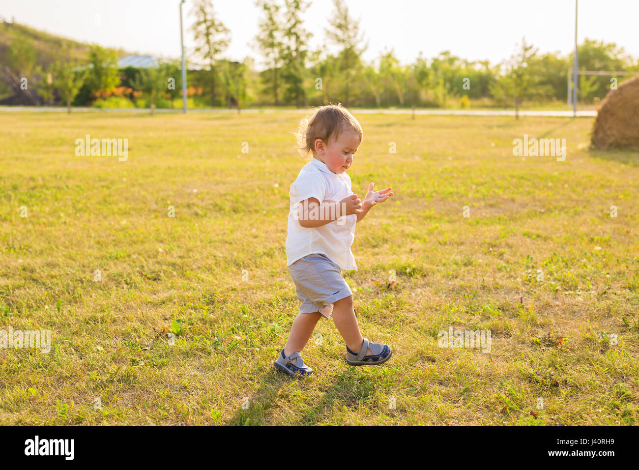 little boy playing in nature Stock Photo - Alamy