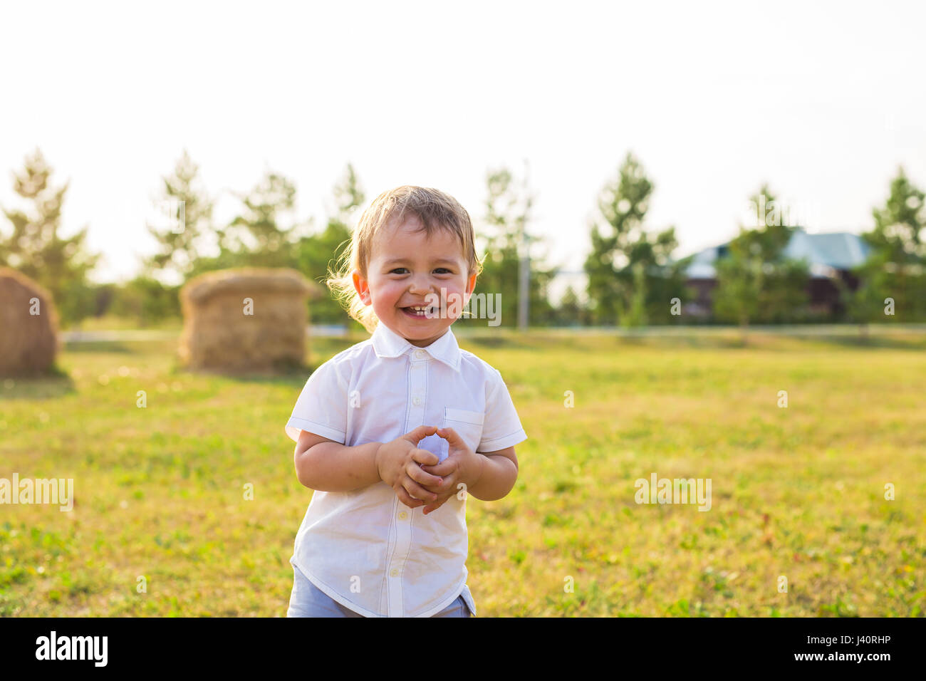 little boy playing in nature Stock Photo - Alamy