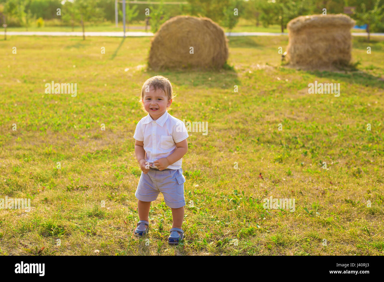 little boy playing in nature Stock Photo - Alamy