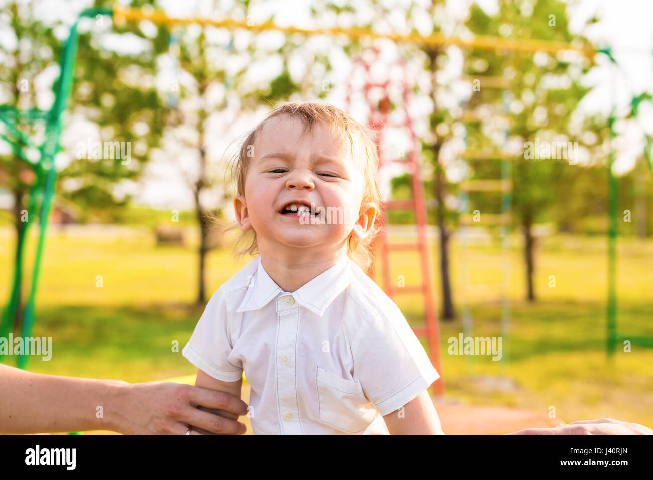 Portrait of Happy laughing funny boy playing in nature Stock Photo - Alamy