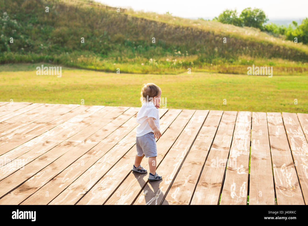 little boy playing in nature Stock Photo - Alamy