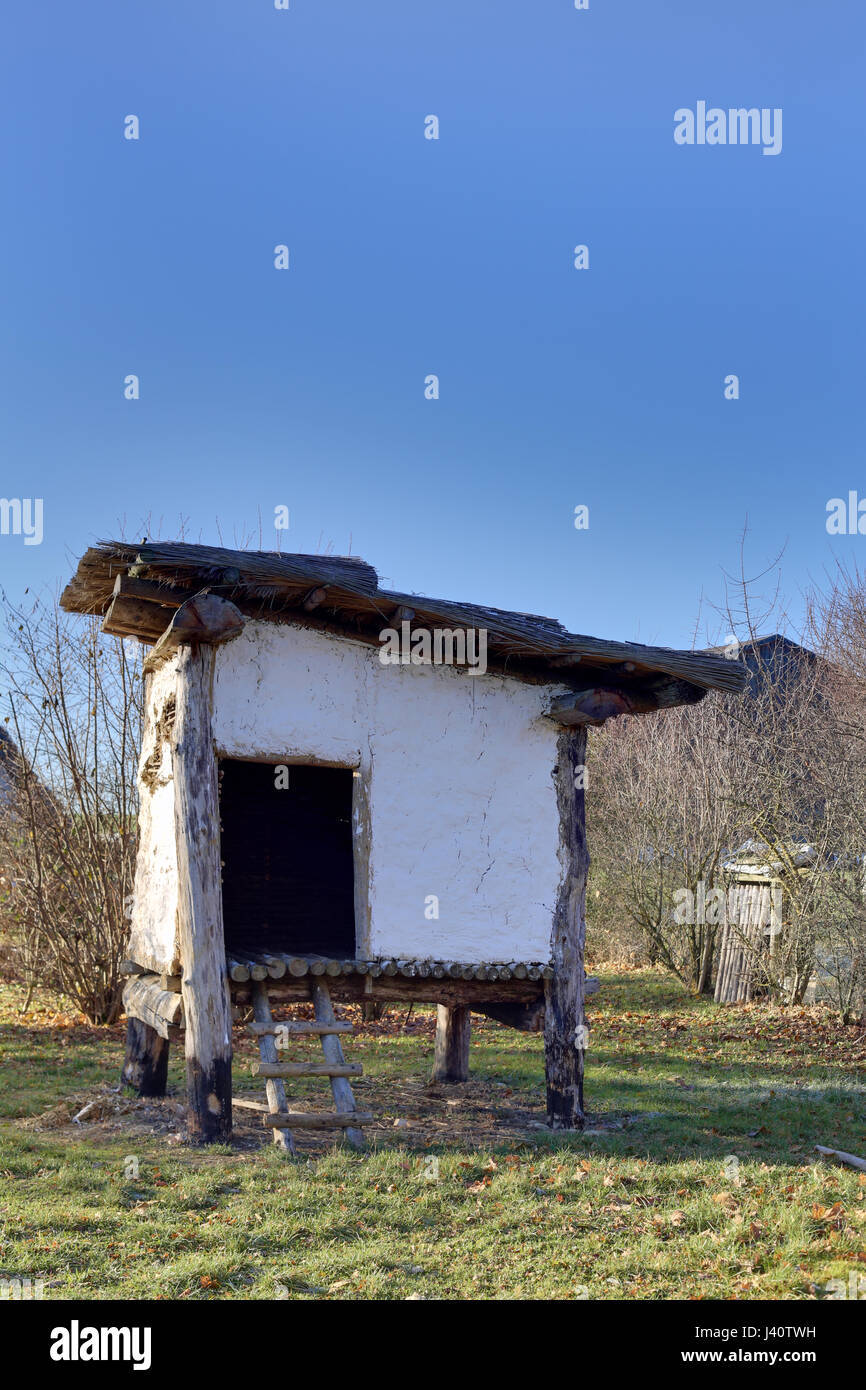 Ancient Celtic building on pillars with a blue sky Stock Photo - Alamy