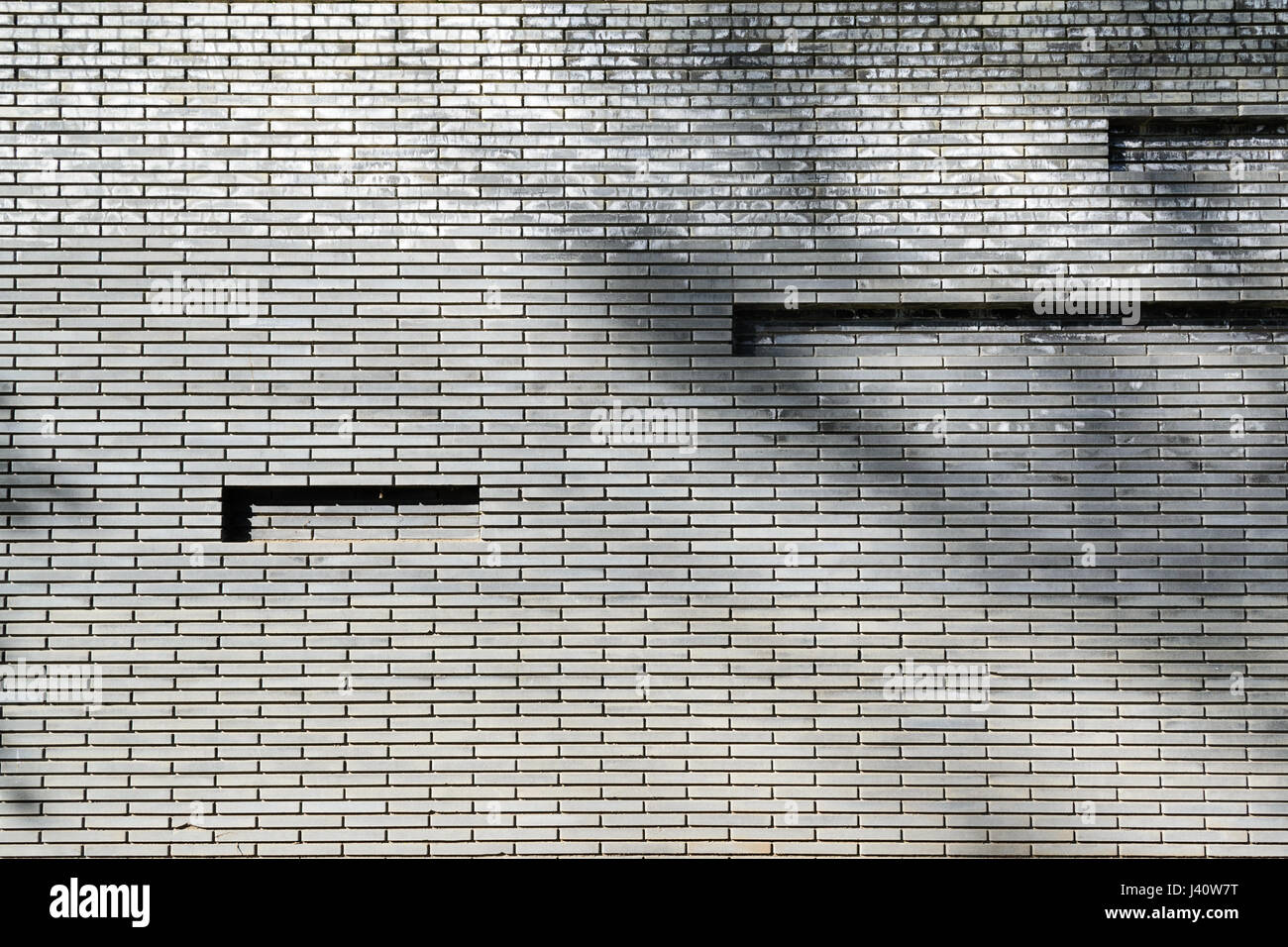 Texture brick fence with a niche daytime. Background Stock Photo - Alamy