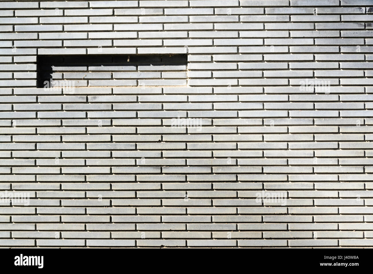 Texture brick fence with a niche daytime. Background Stock Photo - Alamy