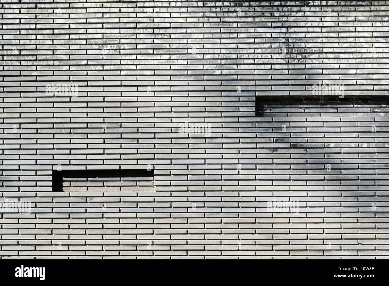 Texture brick fence with a niche daytime. Background Stock Photo - Alamy