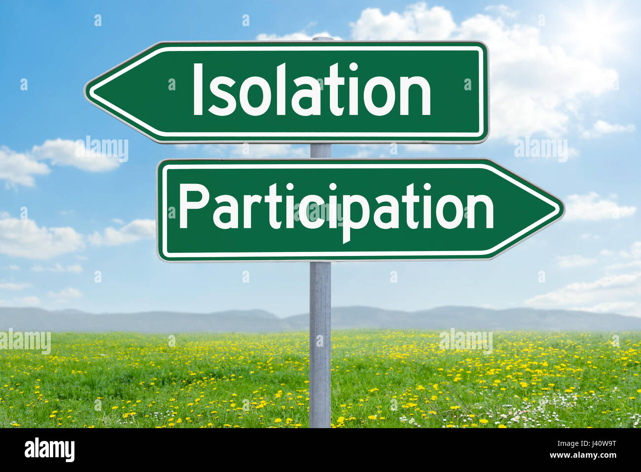 Two green direction signs - Isolation or Participation Stock Photo - Alamy