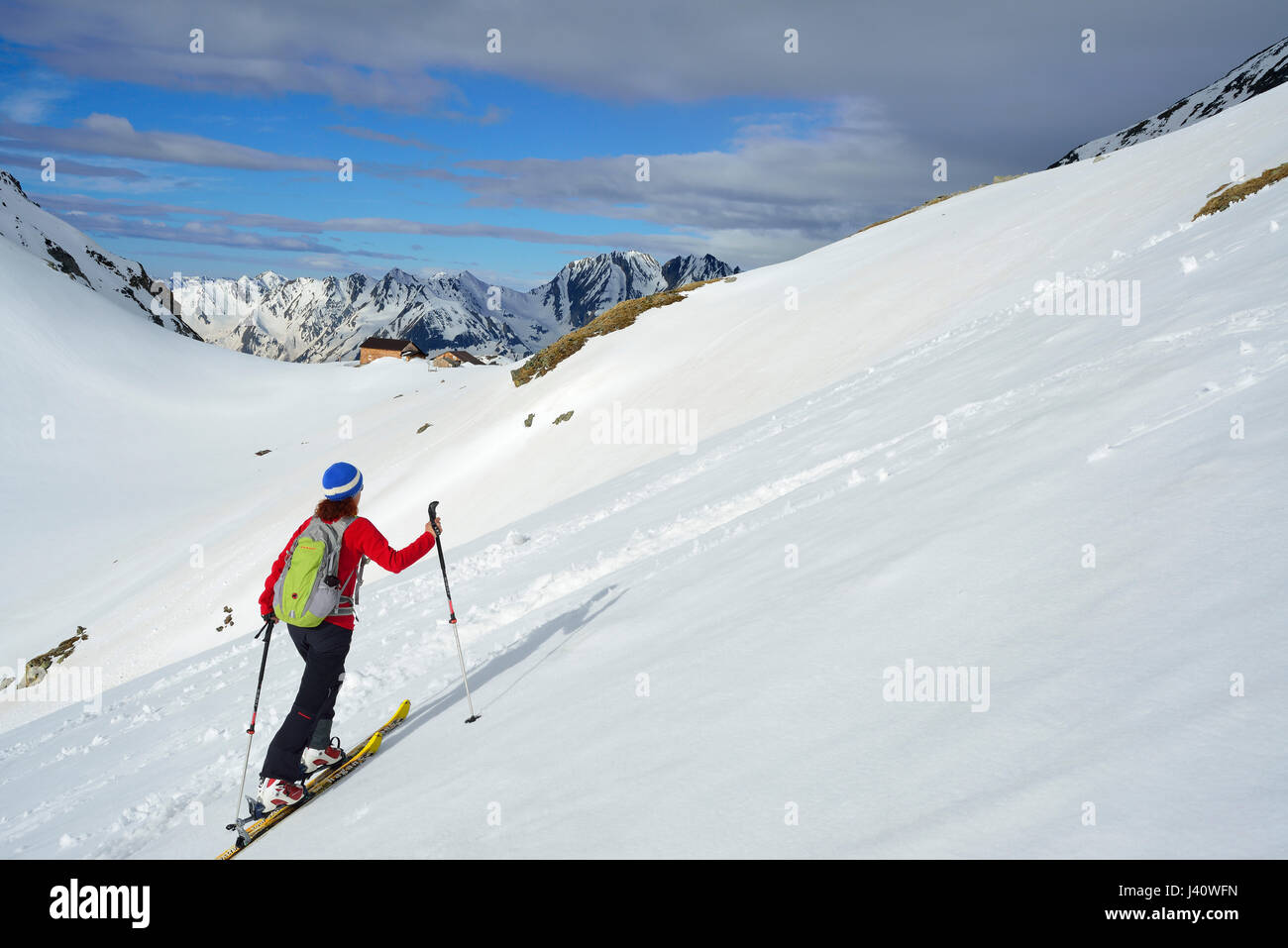 Female back-country skier ascending to hut Eisbruggjochhuette, Hoher ...