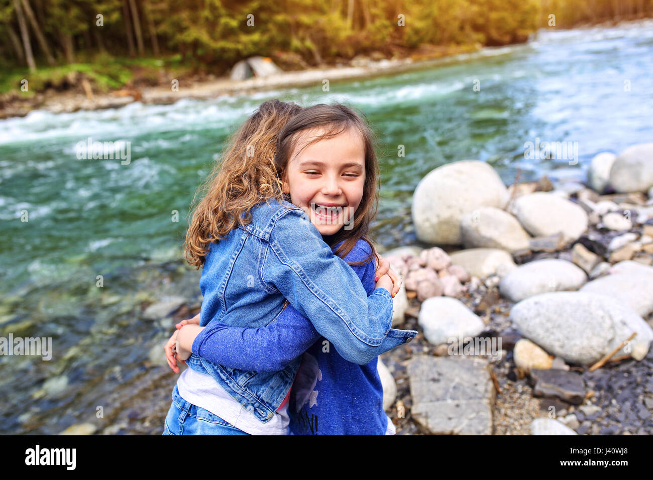 Friendship between two young girls Stock Photo - Alamy