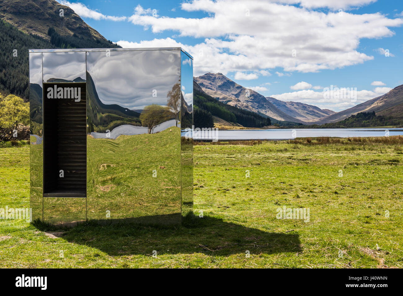A mirrored building located at Loch Doine in the Trossachs, Scotland ...
