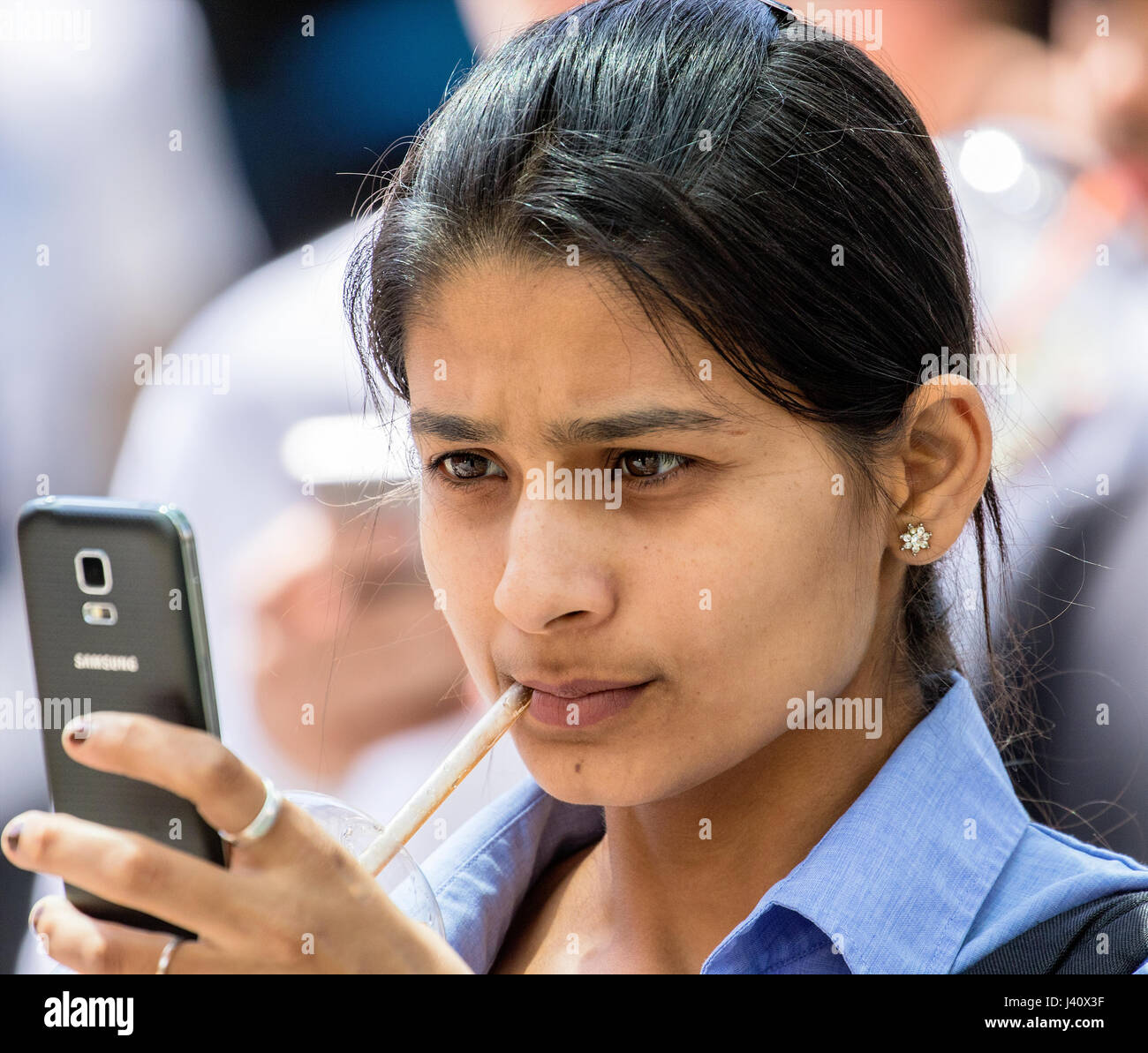 pretty asian girl using mobile phone Stock Photo - Alamy