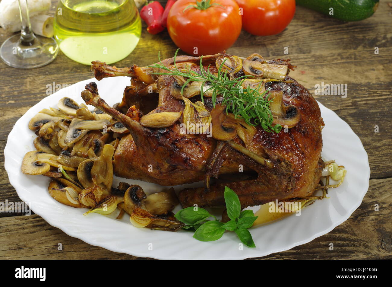 whole roast honey duck on white plate Stock Photo - Alamy