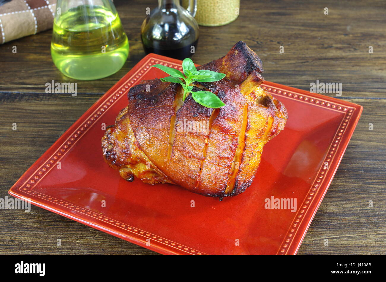 appetizing baked knuckles of pork on plate Stock Photo - Alamy