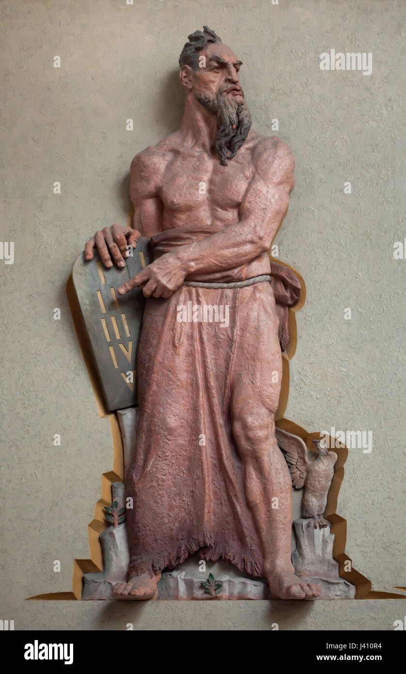 Moses holding the Ten Commandments. Coloured clay relief by Czech ...