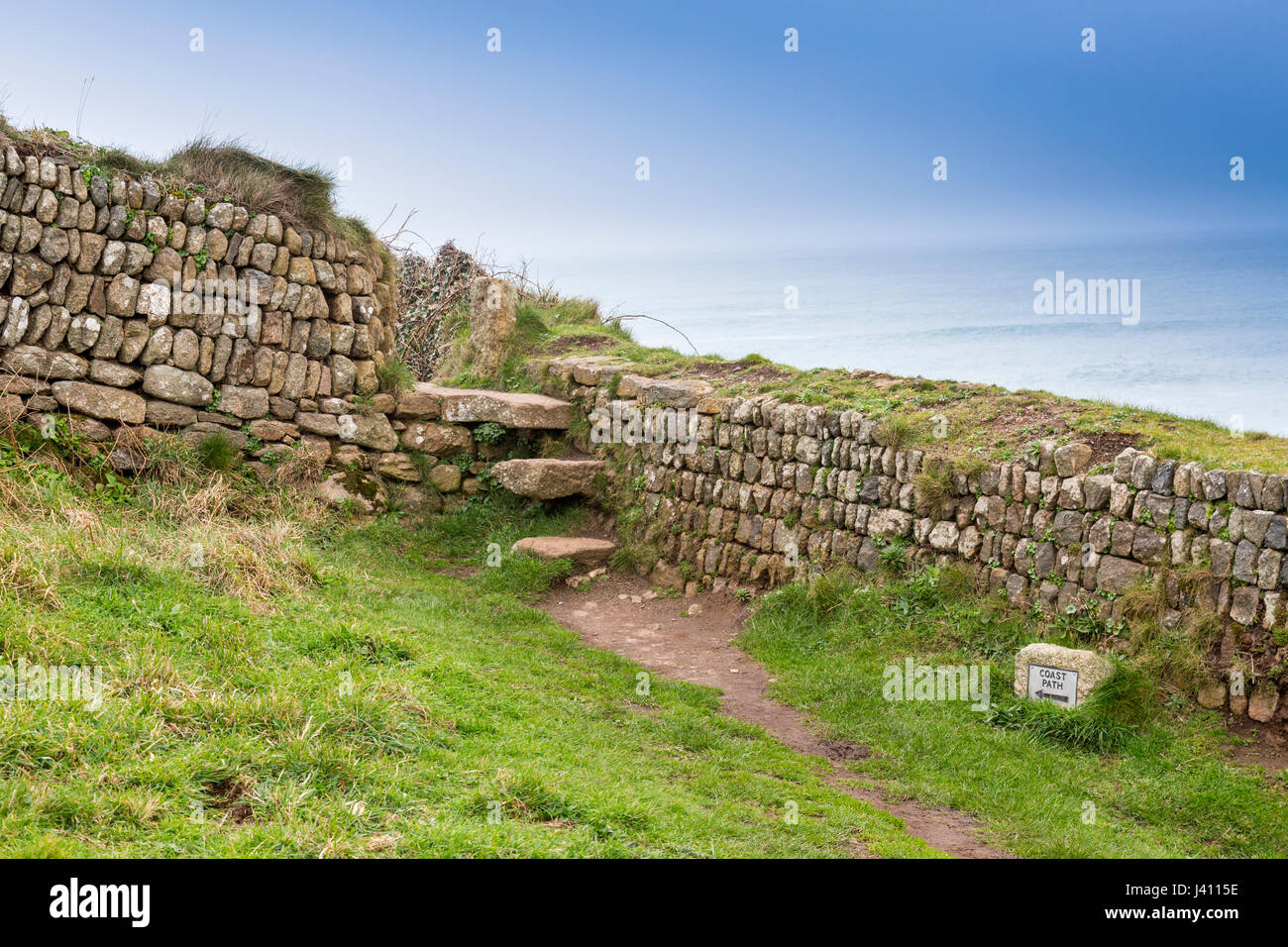A step stile in a dry stone wall built from granite blocks of different ...