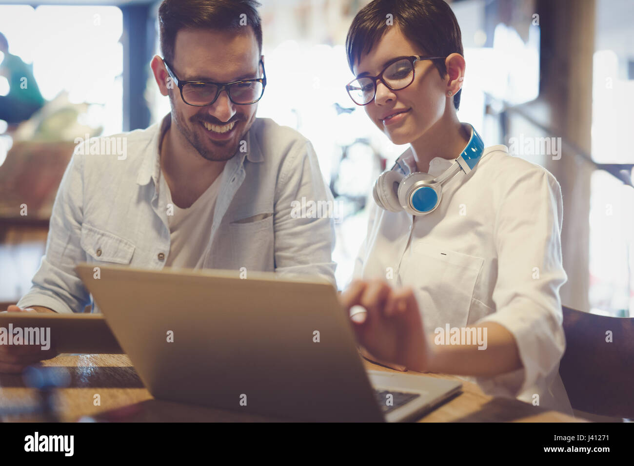 Smart University students studying for exams on laptop Stock Photo - Alamy