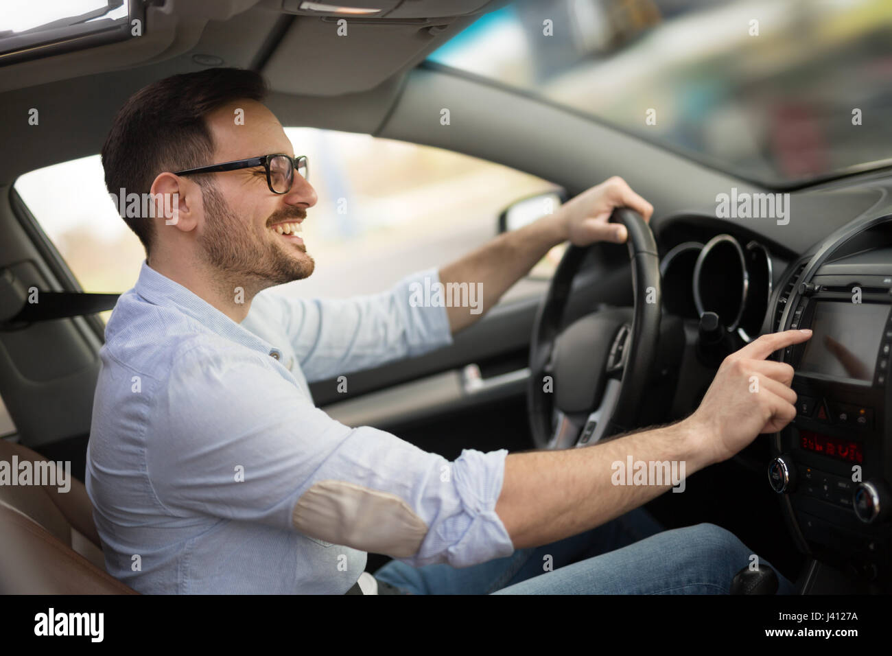 Man Using Gps Navigation System In Car to travel Stock Photo - Alamy