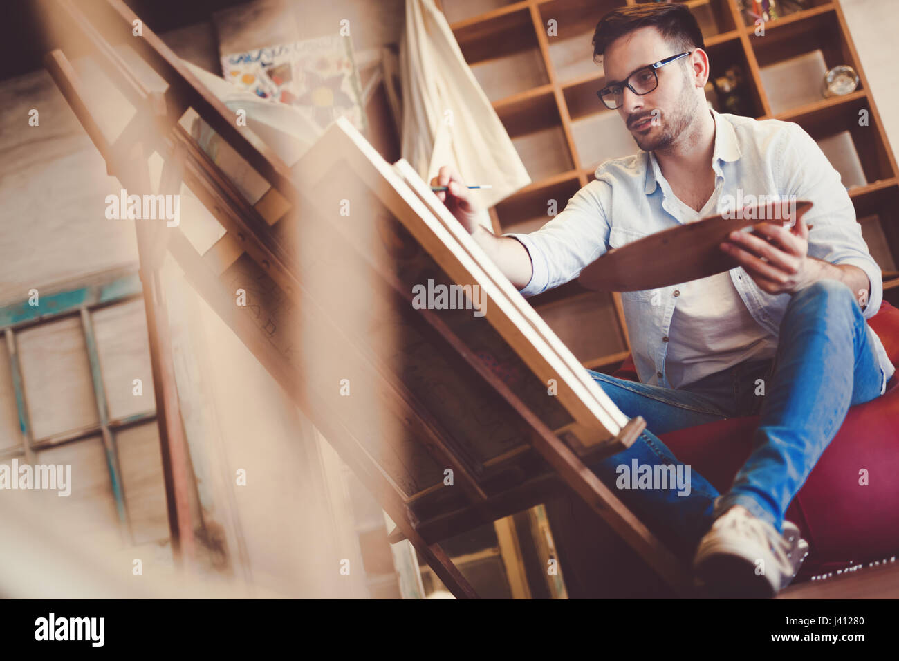Portrait Of Male Artist Working On Painting Art In Studio Stock Photo ...