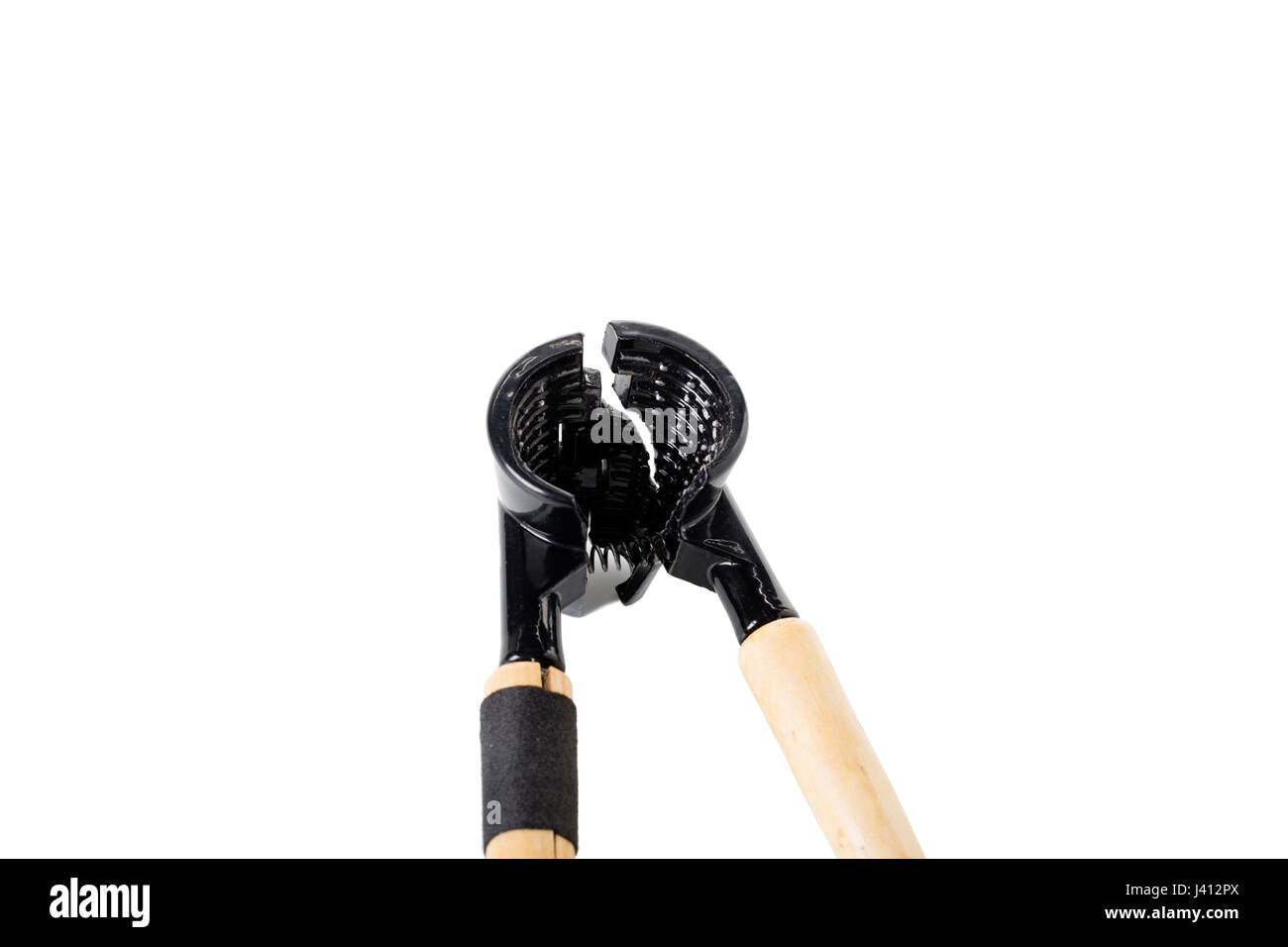 Nutcracker with wooden handle is broken. Isolated on the white ...