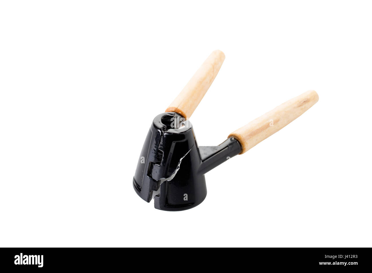 Nutcracker with wooden handle is broken. Isolated on the white ...