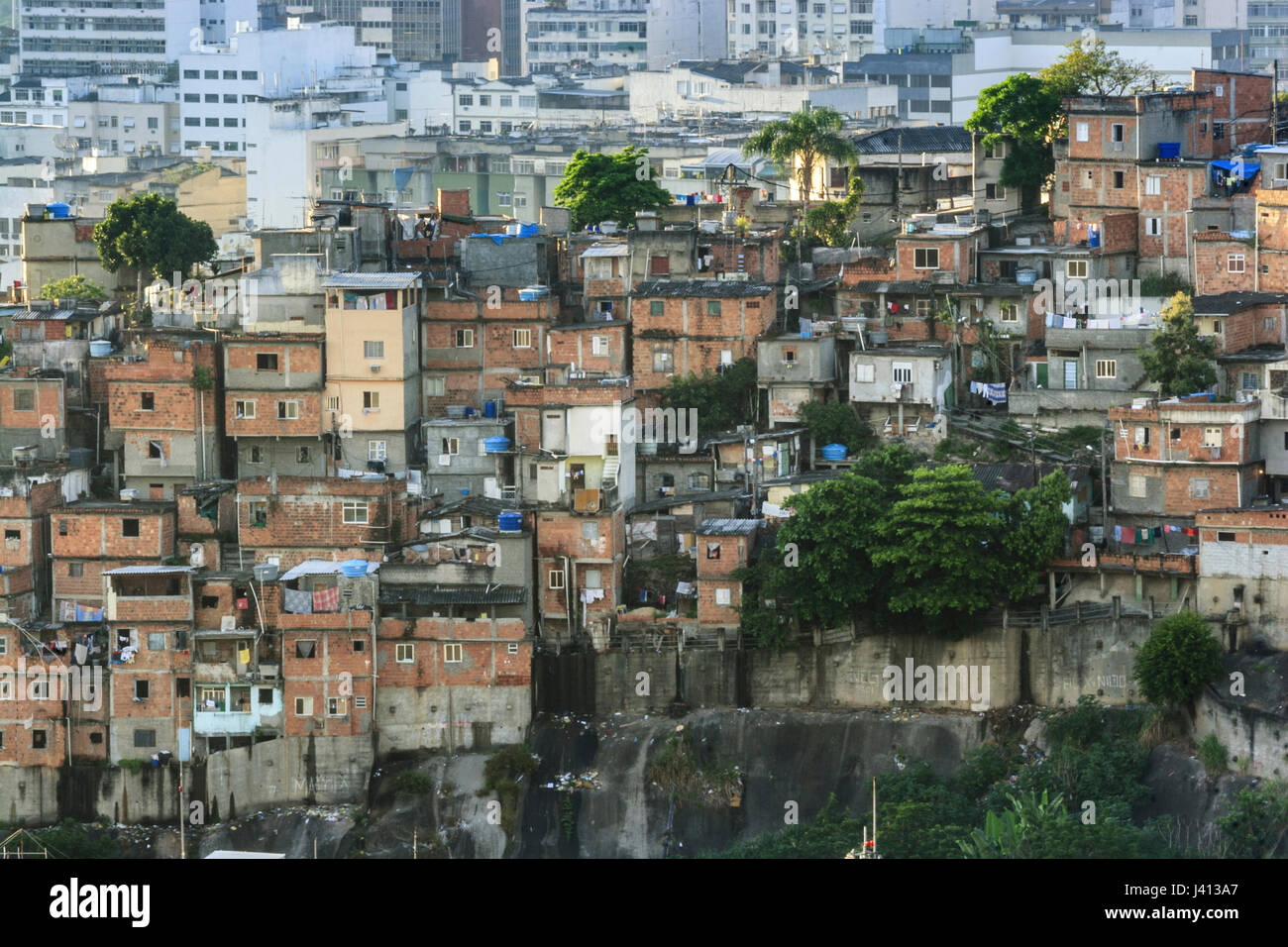 A favela - slum or shanty town - in Santa Teresa with the skyline of ...