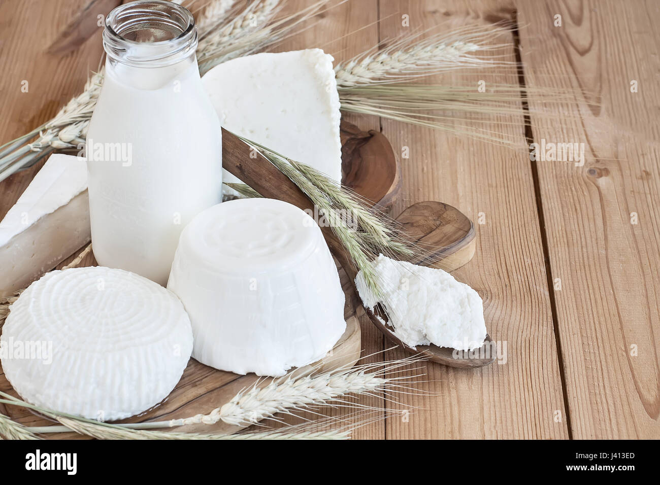 Cheese, milk and wheat - symbols of judaic holiday Shavuot. Copy space ...
