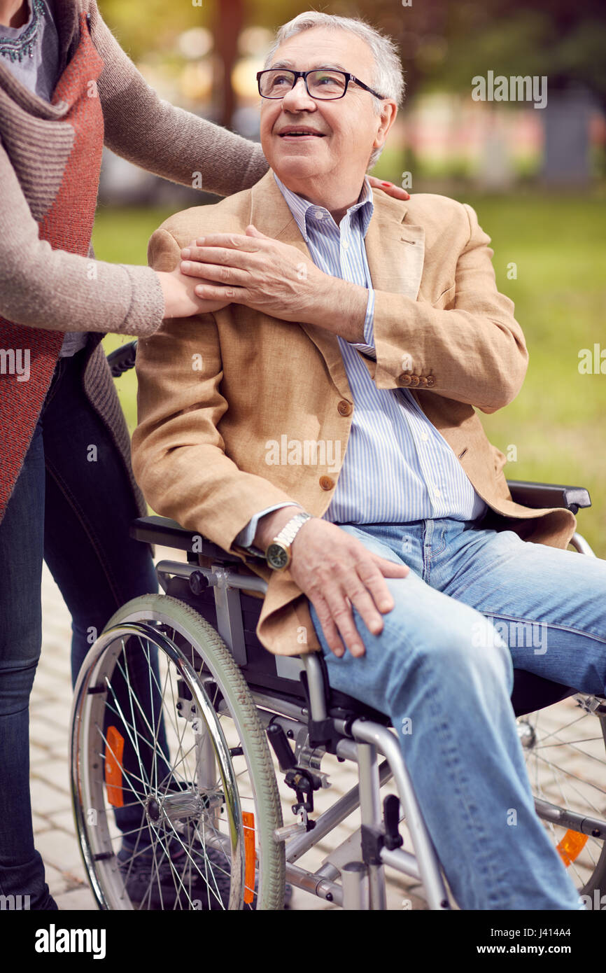 support disabled positive elderly man in wheelchair Stock Photo - Alamy