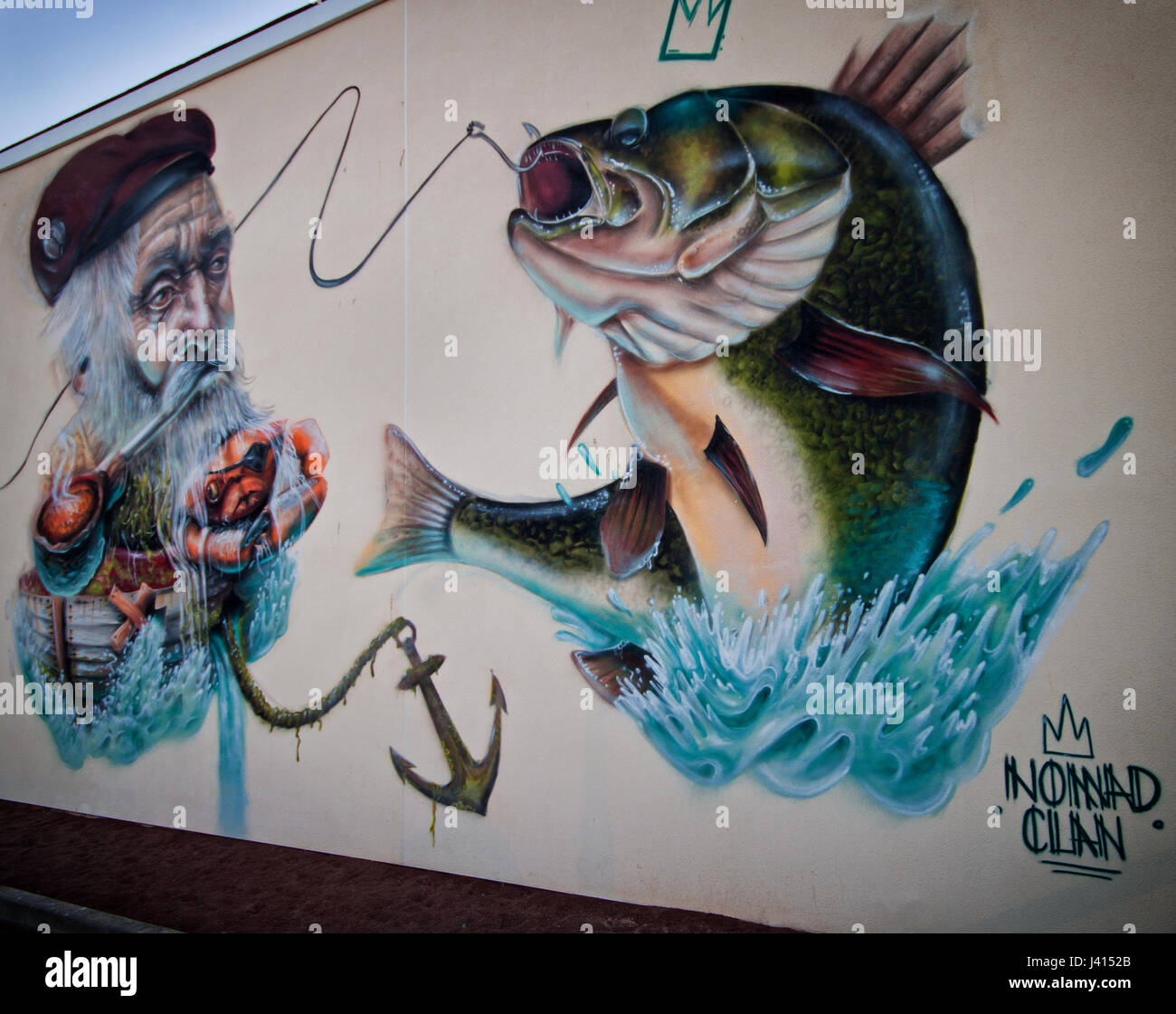 An exceptional catch: mural of sailor and fish on line. Blackool urban ...