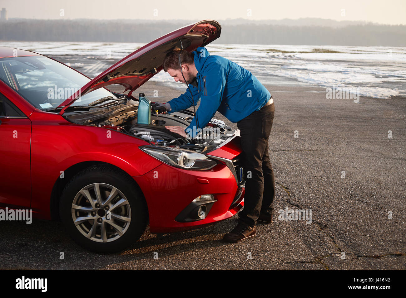 Inspecting car oil hi-res stock photography and images - Alamy