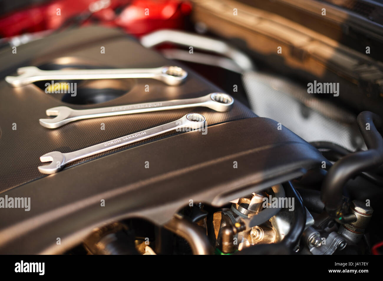 Close up car engine with tools Stock Photo - Alamy