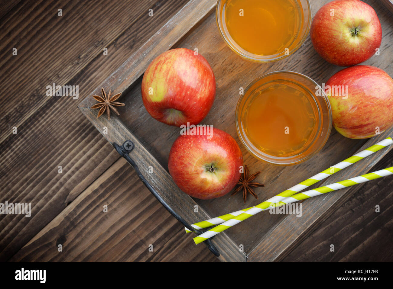 Apple cider in glass with fresh apples on wooden background Stock Photo ...