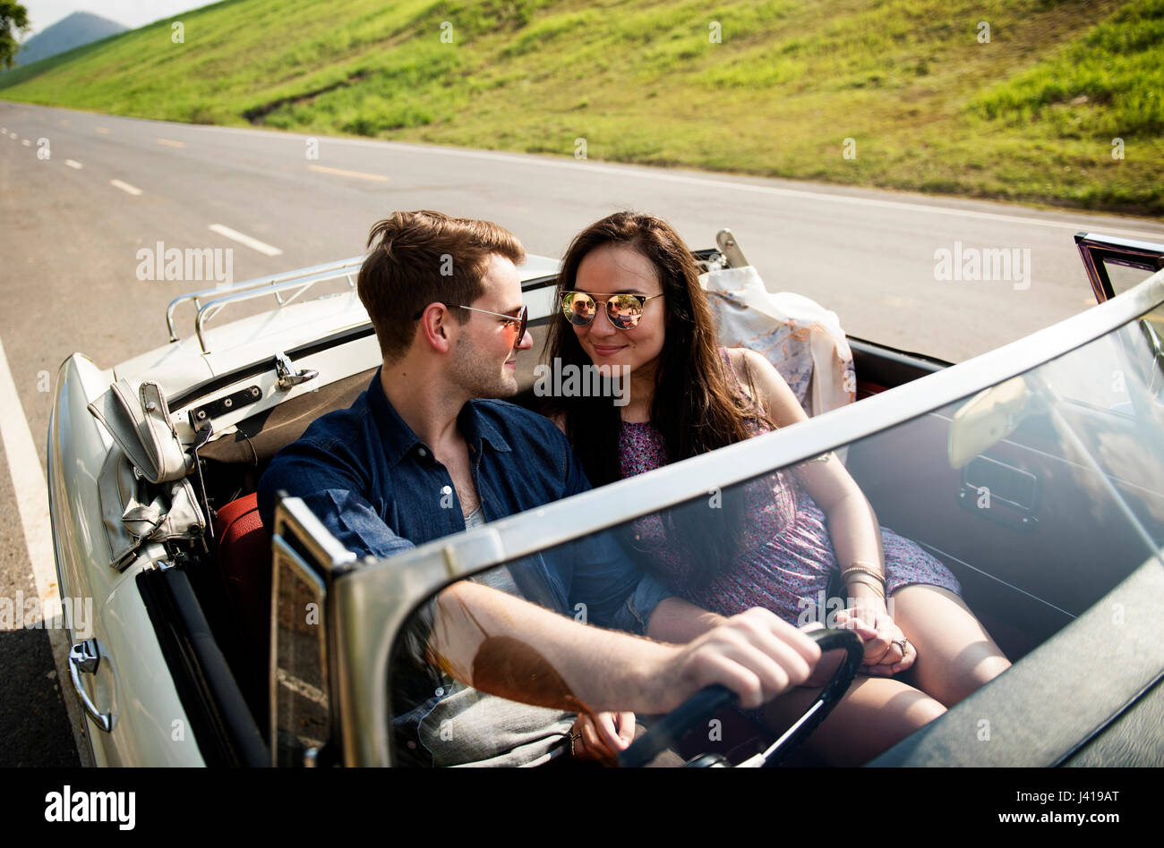 Couple Driving a Car Traveling on Road Trip Together Stock Photo - Alamy